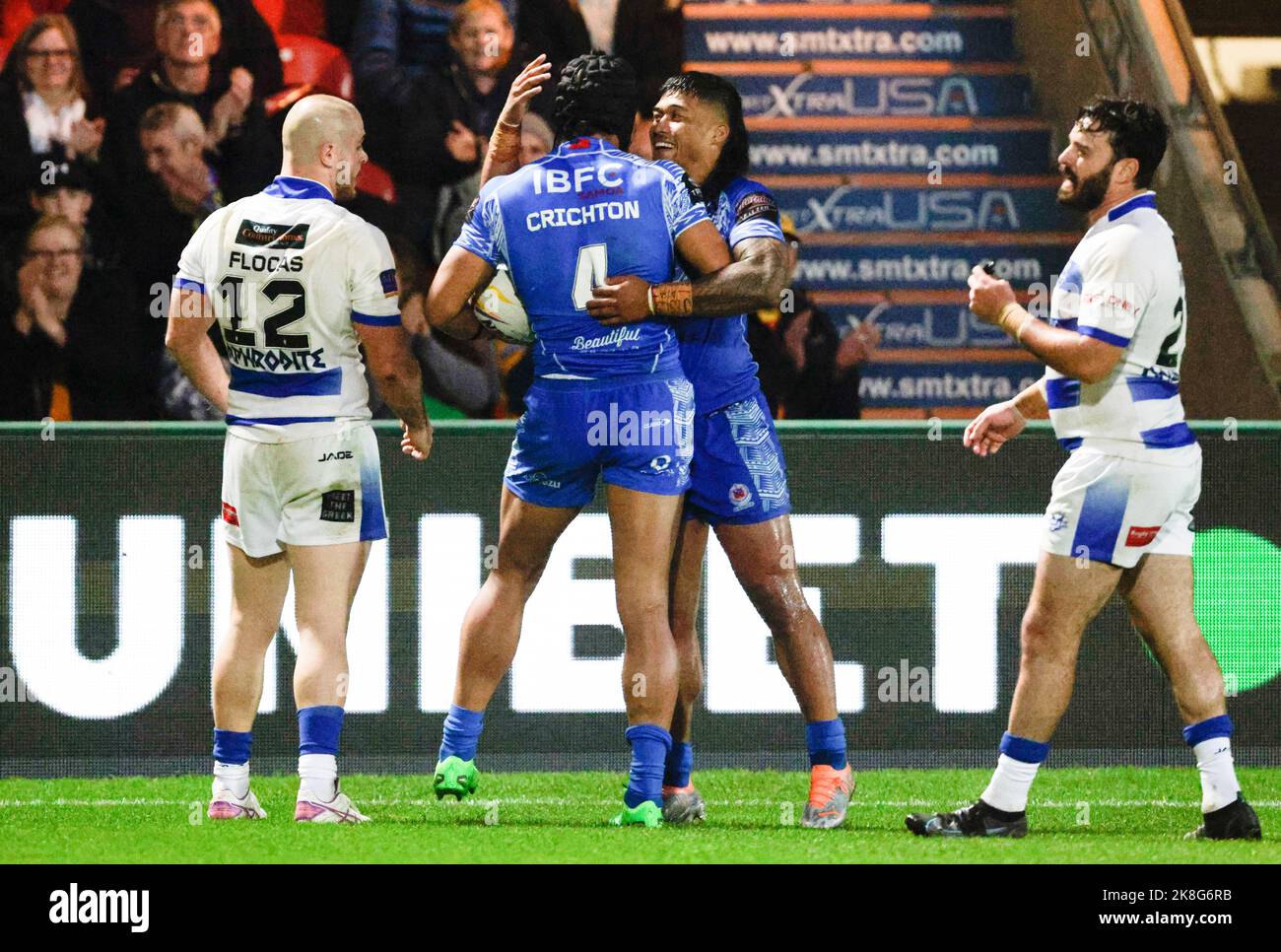 Samoa's Stephen Crichton celebrates after scoring a try with Brian To’o ...