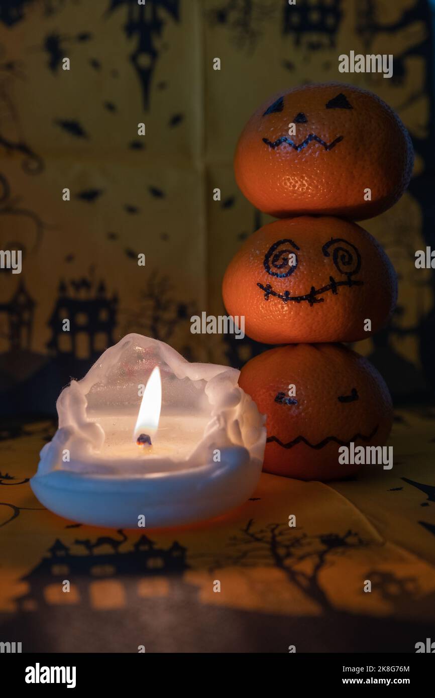 3 Clementines painted like a halloween pimpkin, happy halloween Stock ...