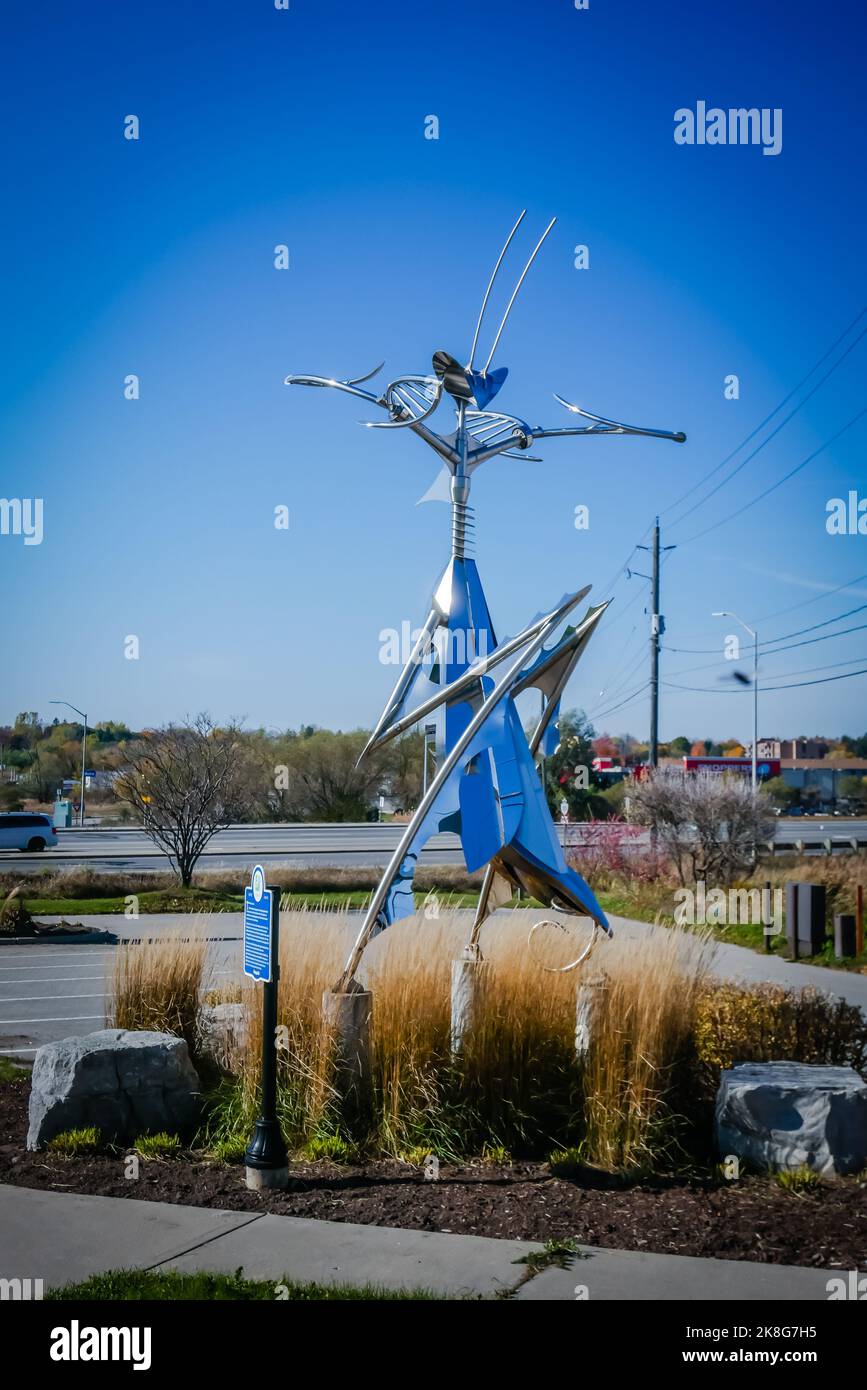 Seven meter tall praying matise artowrk made of stainless steel ...