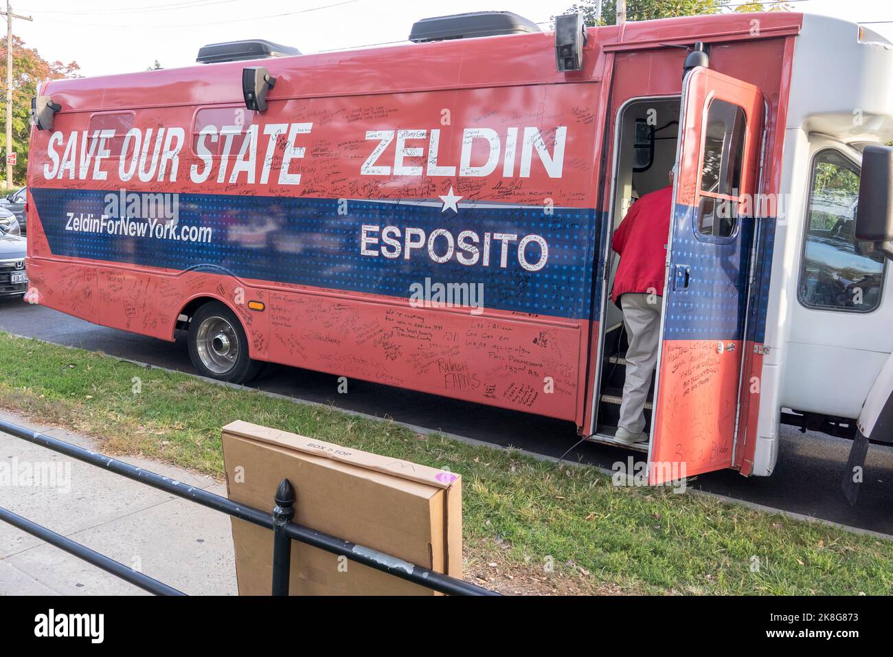 A man enters the campaign bus outside Francis Lewis Park at foot of the ...