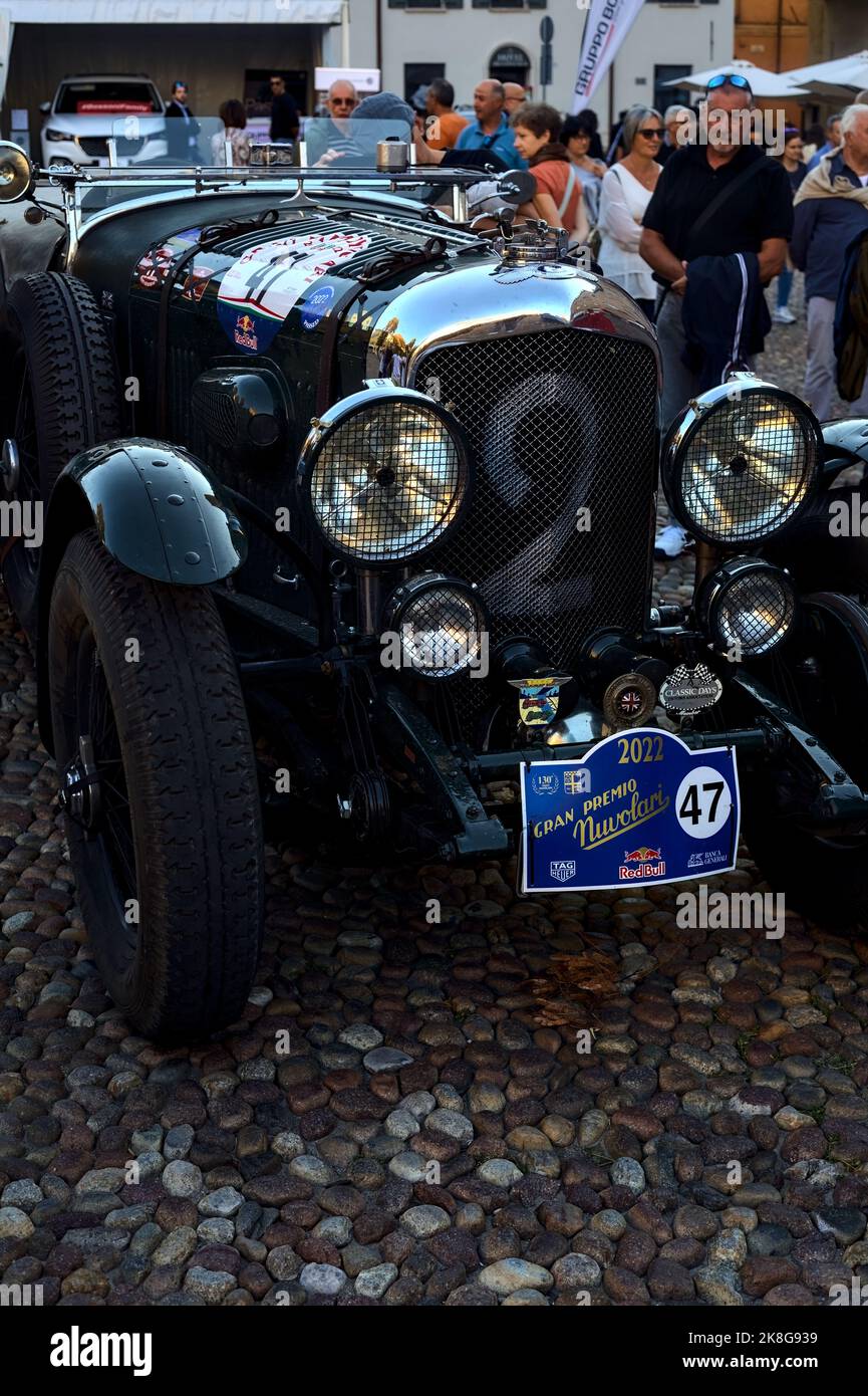 Old Bentley car surrounded by people watching it during the 2022 ...