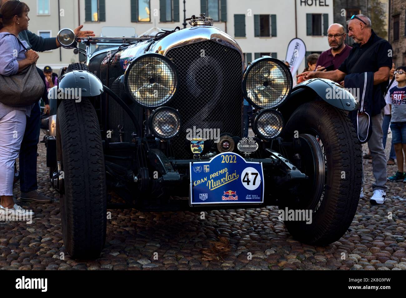 Old Bentley car surrounded by people watching it during the 2022 ...