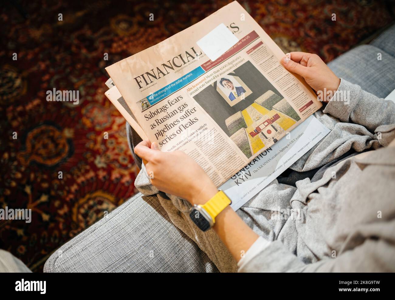 London, United Kingdom - Sept 28, 2022: Woman reading Financial Times ...