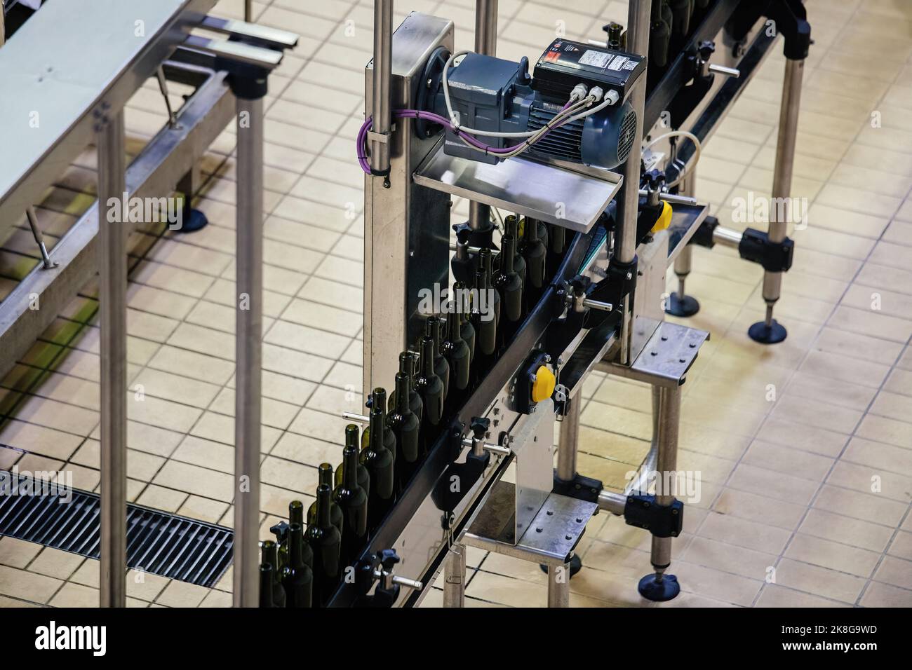 Bottling and sealing wine conveyor production line at modern winery ...
