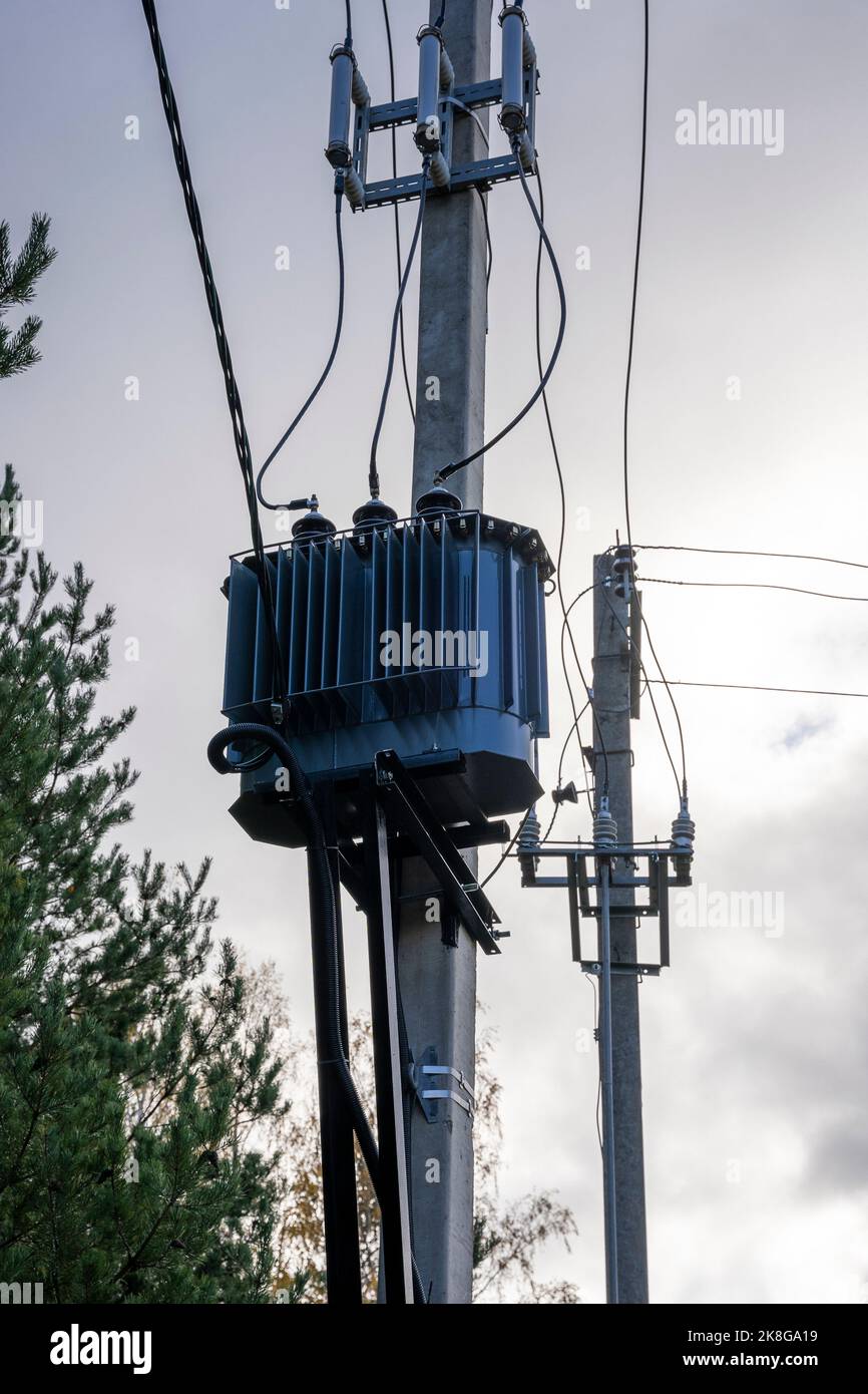 network transformer installed and fixed on a reinforced concrete pole ...