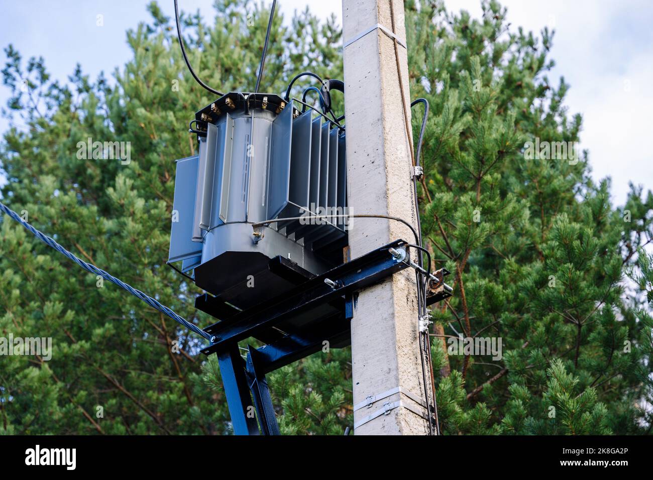network transformer installed and fixed on a reinforced concrete pole ...