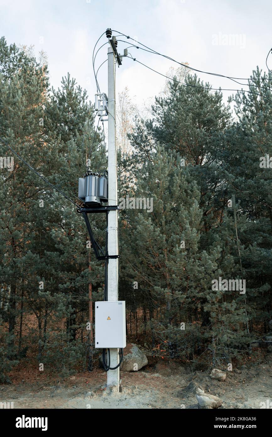 network transformer installed and fixed on a reinforced concrete pole ...