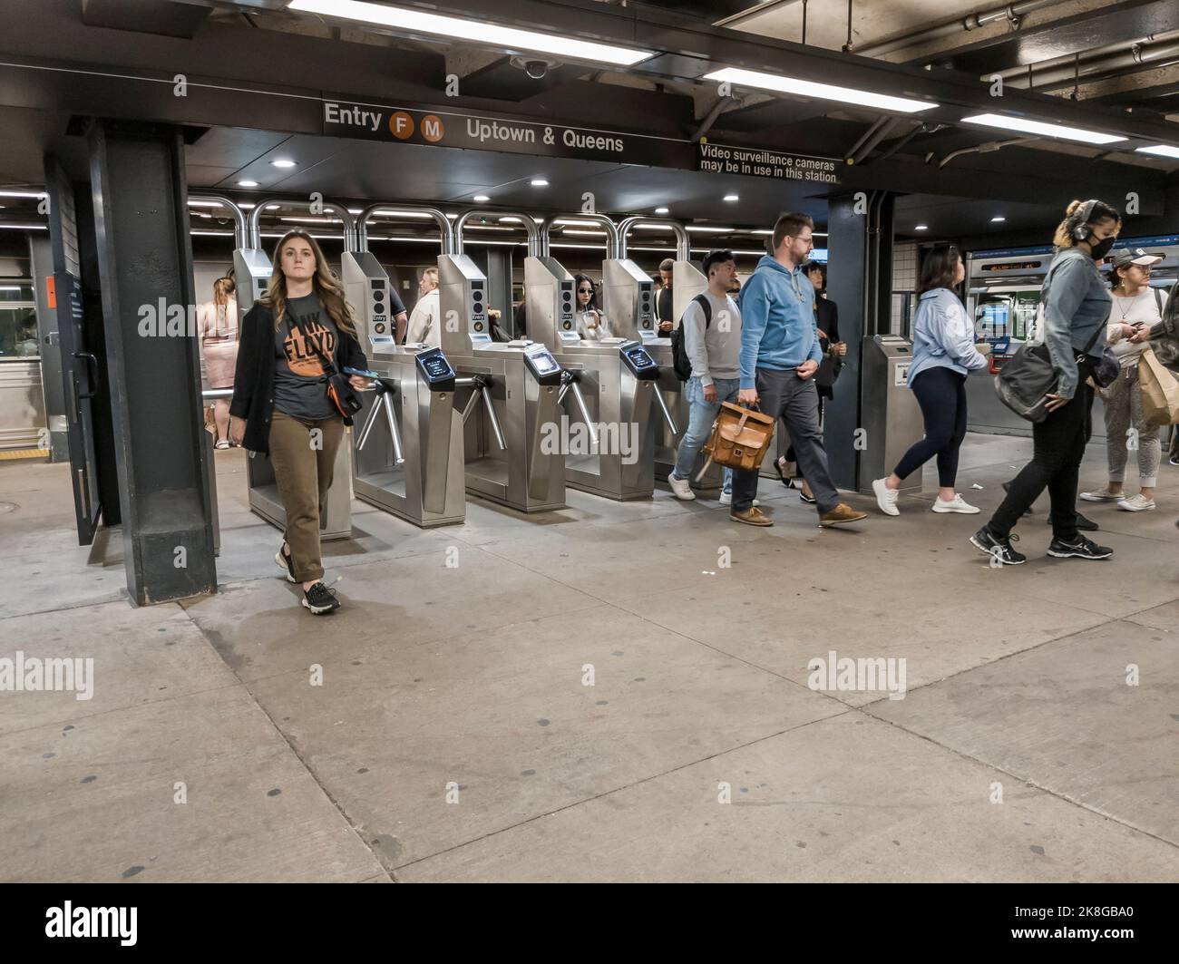 Weekend subway ridership in New York, riders exit the West 23rd Street ...