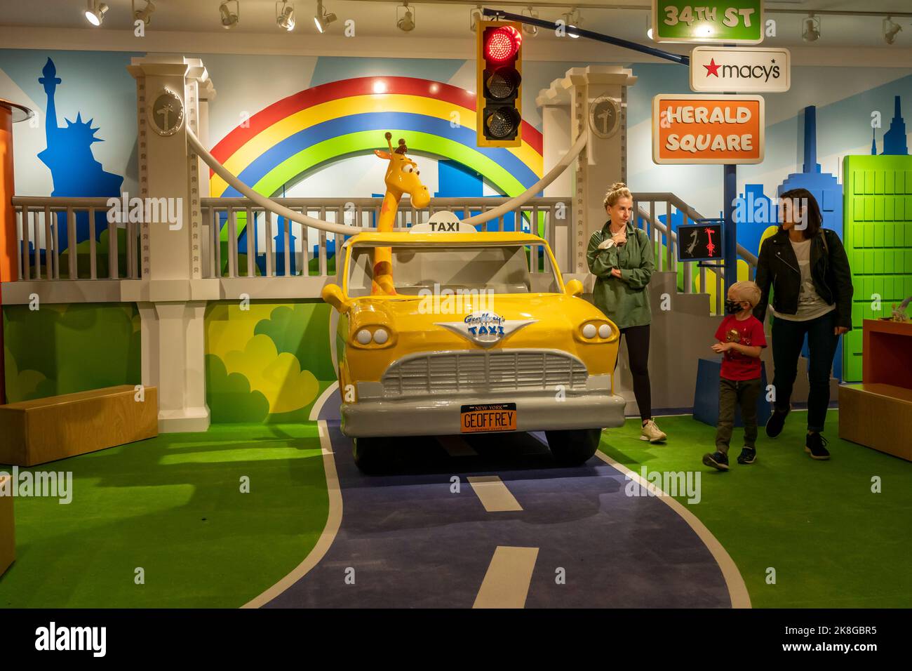People visit the new Toys “R” Us located in the Macy’s Herald Square ...