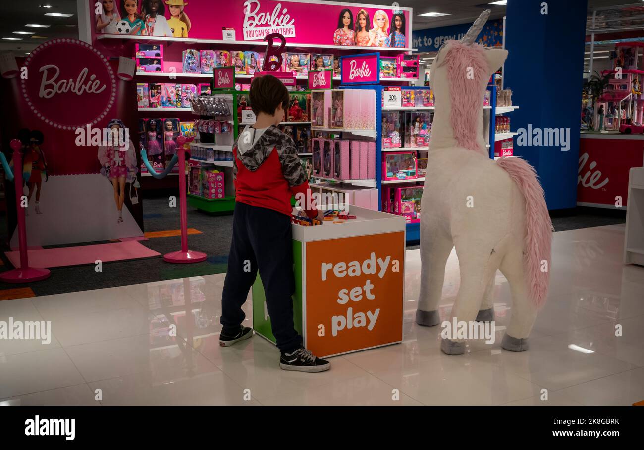 People visit the new Toys “R” Us located in the Macy’s Herald Square department store on opening ...