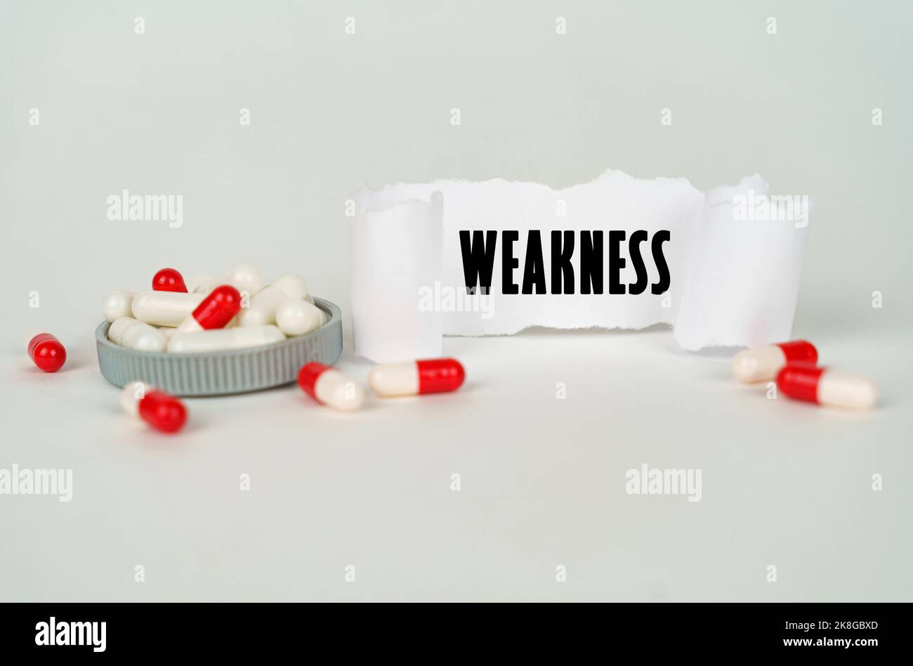 Medical concept. On a gray background, medical capsules and a paper ...