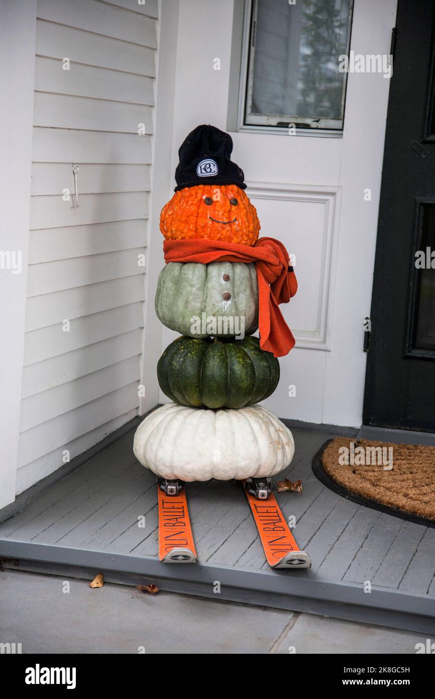 Pumpkin snowman on skis on a front porch display in Woodstock, Vermont ...
