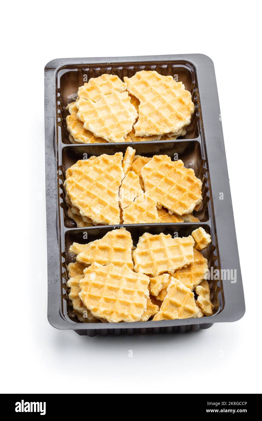 Broken round waffle in plastic pack isolated Stock Photo - Alamy