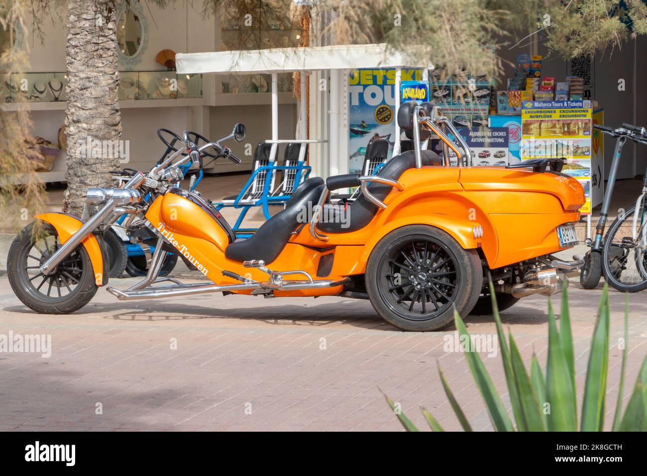 3 wheeled orange custom motorbike on sea front can pastilla mallorca ...