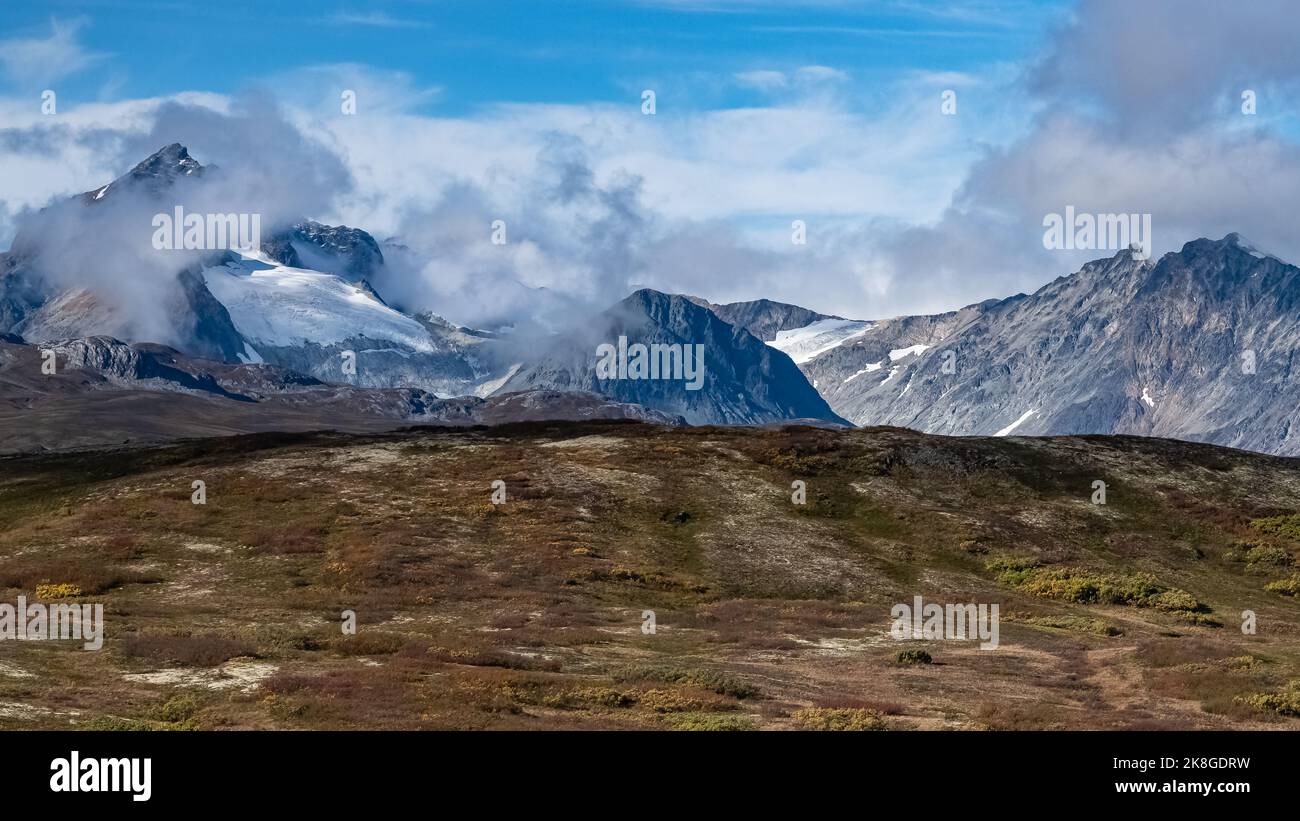 Canada, Yukon, view of the tundra in autumn, with mountains in ...