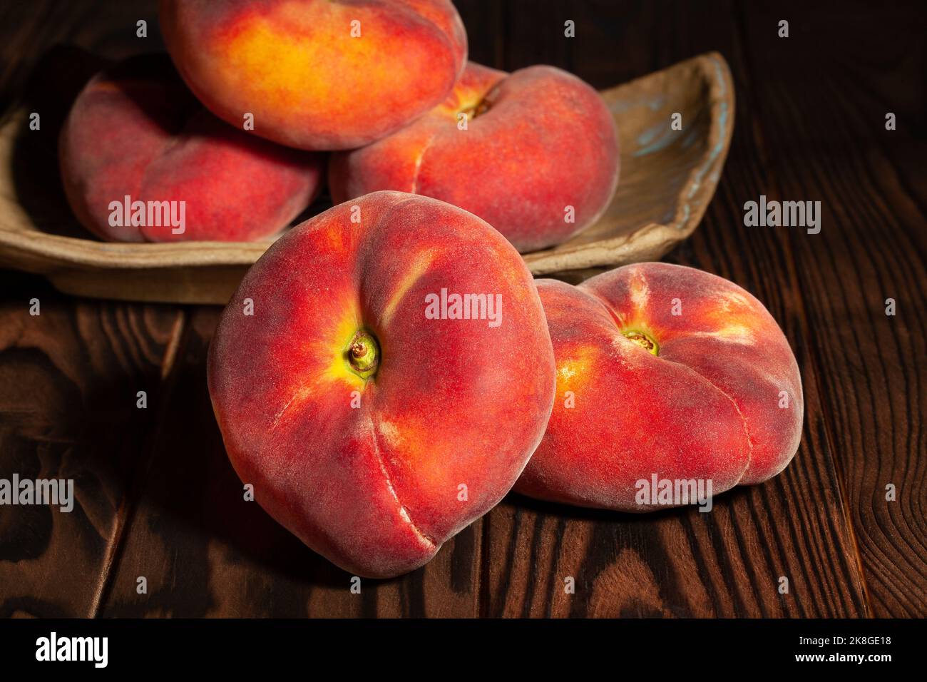 flat peach on wood background Stock Photo - Alamy