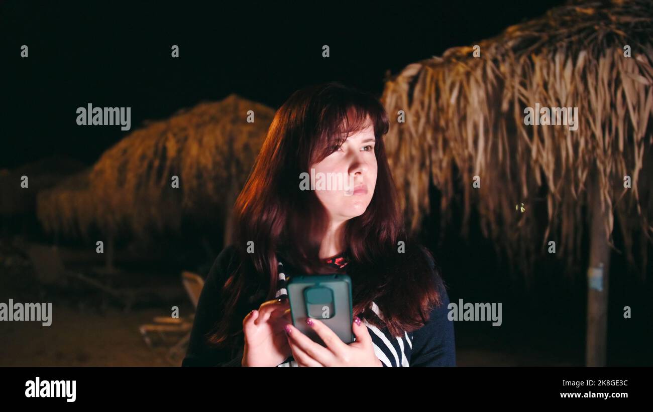 Amazing Young Woman Is Lost And Looks Around And Into The Phone Stock ...