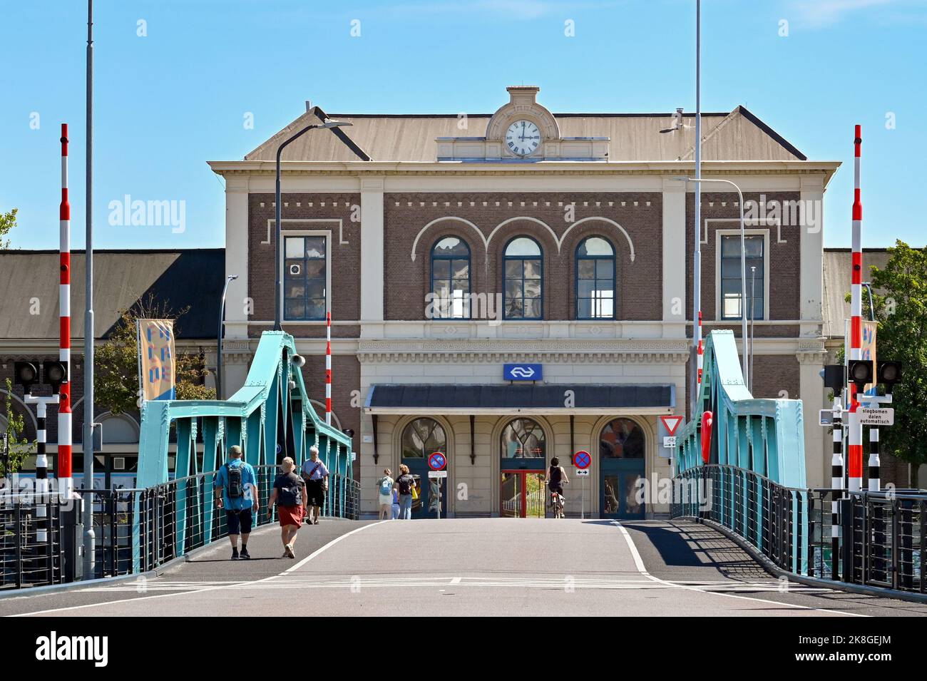 Middelburg, Netherlands - August 2022: People walking over a bridge to ...