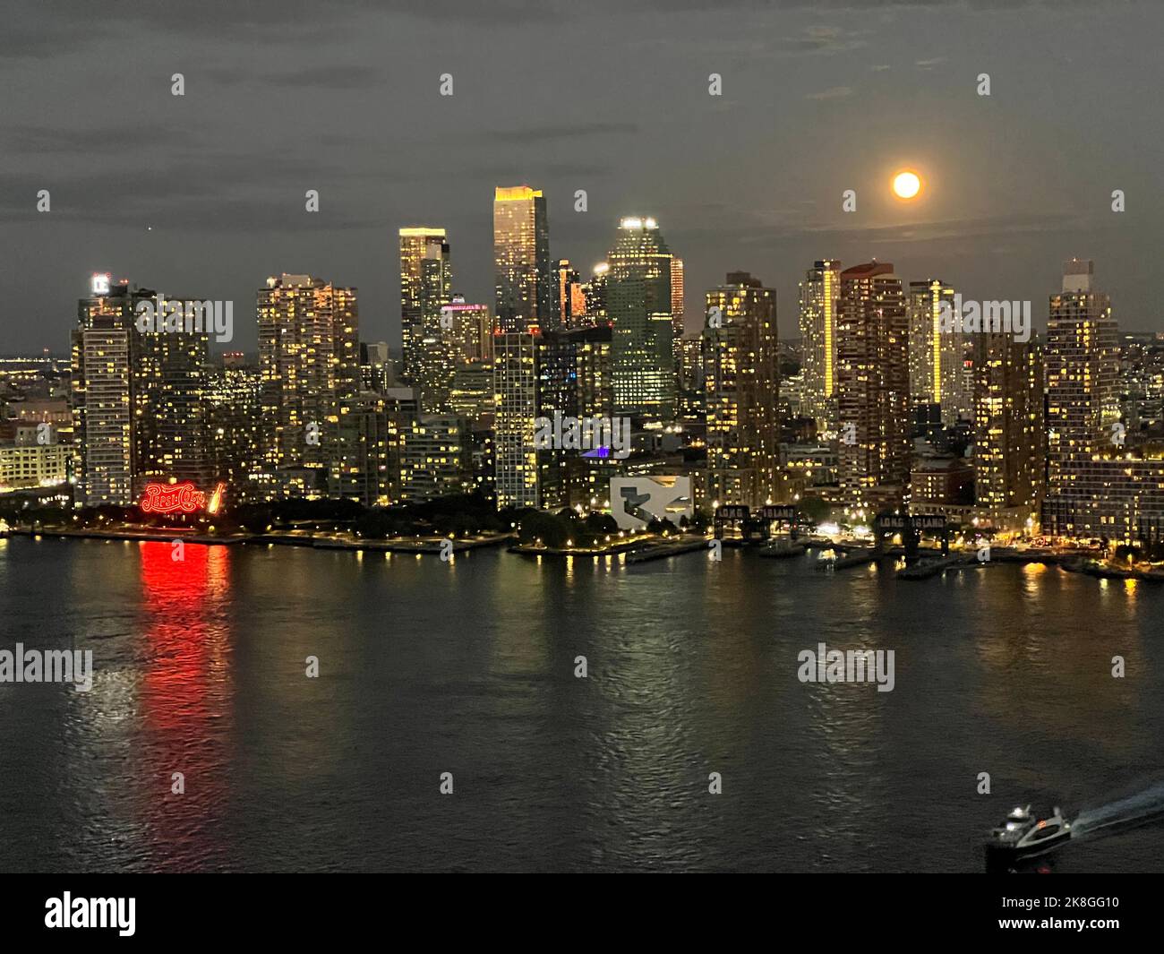 Full moon rise over the skyline along the Long Island City Astoria ...