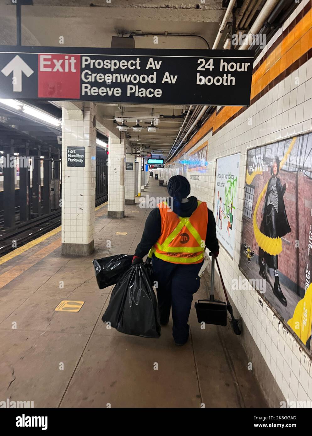 MTA custodial worker emptying trash and cleaning at the Fort Hamilton ...
