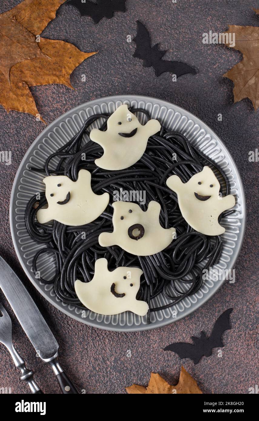 Black Spaghetti and Cheese Ghosts, Edible Halloween Idea, Top view ...