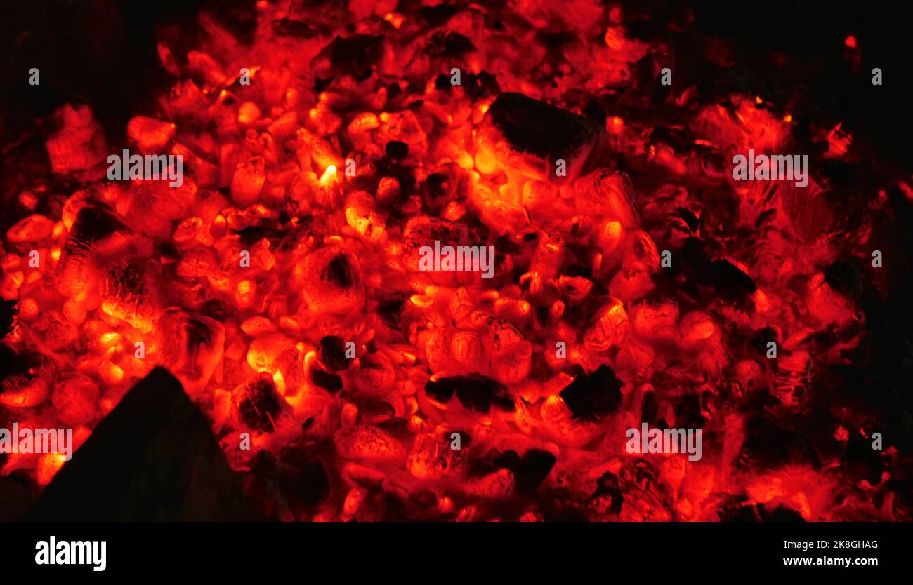 Burning red organic charcoal texture in bbq grill Stock Photo - Alamy