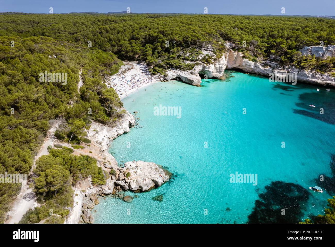 From above spectacular view of cala mitjana rocky green coast in ...