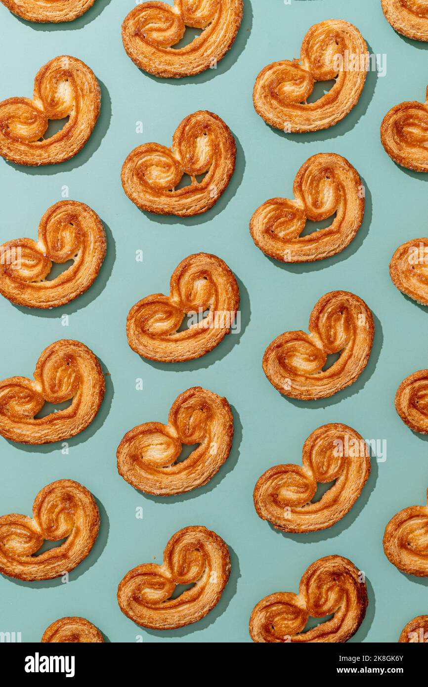 Top view of delicious baked elephant ear cookies placed in lines on ...
