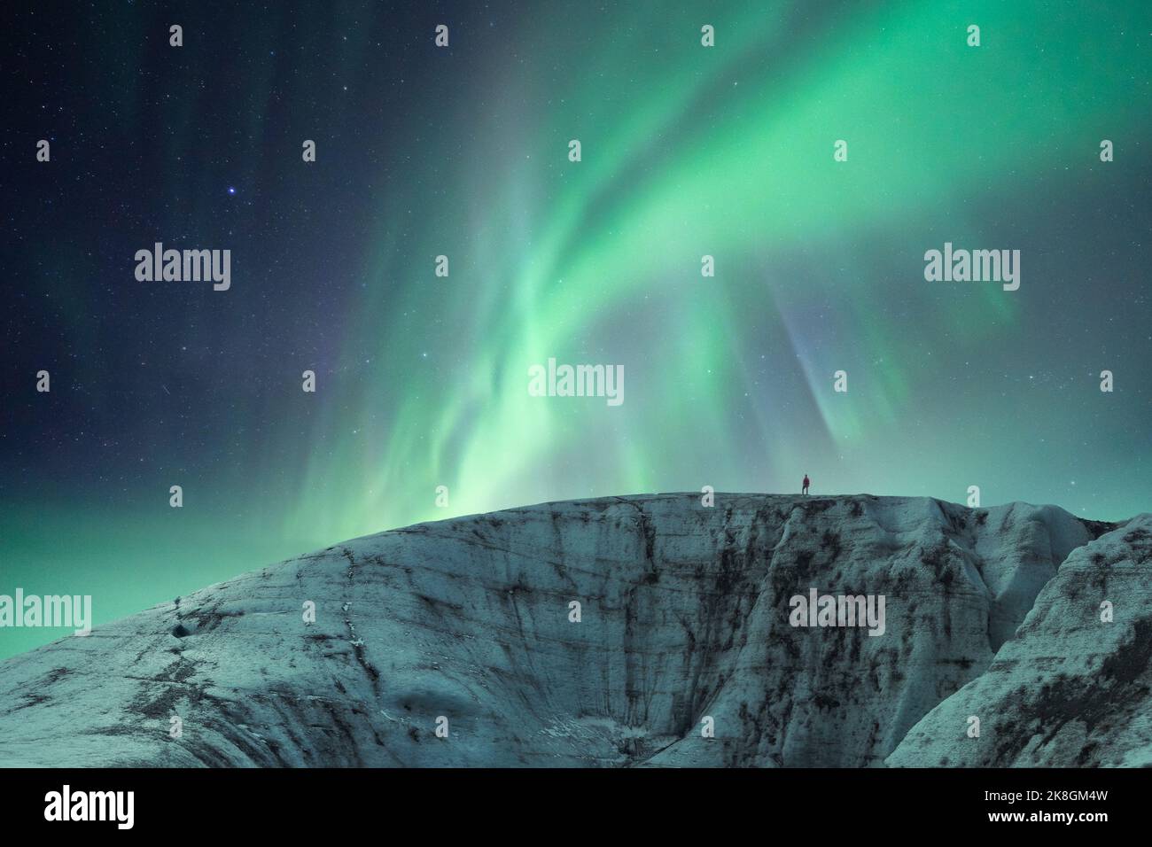 Uneven ice formation of Vatnajokull Glacier with tourist located ...