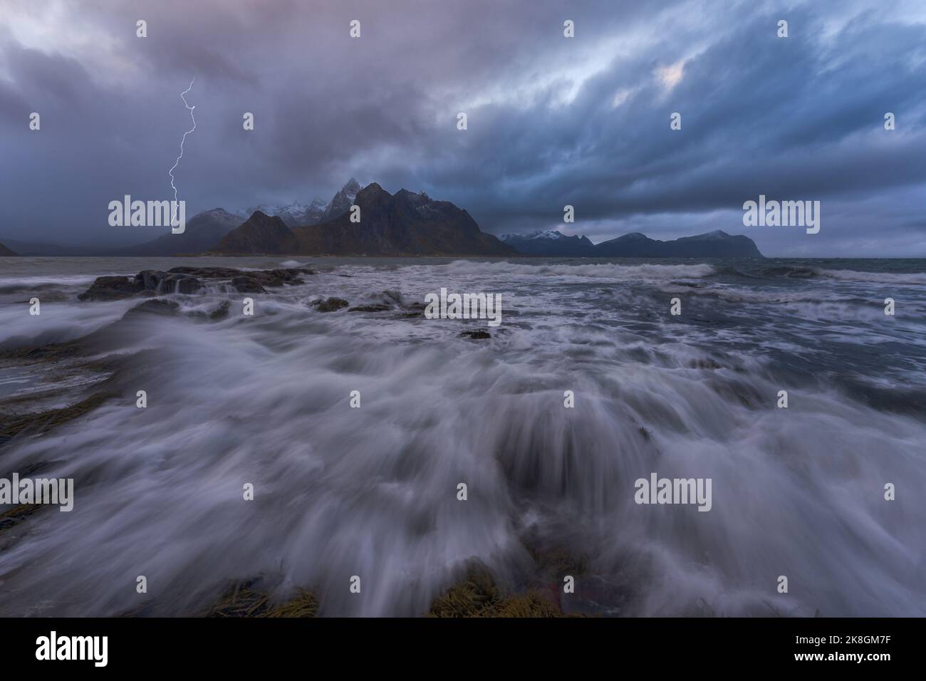 Dramatic view of bright lightning in gloomy cloudy sky flashing above ...