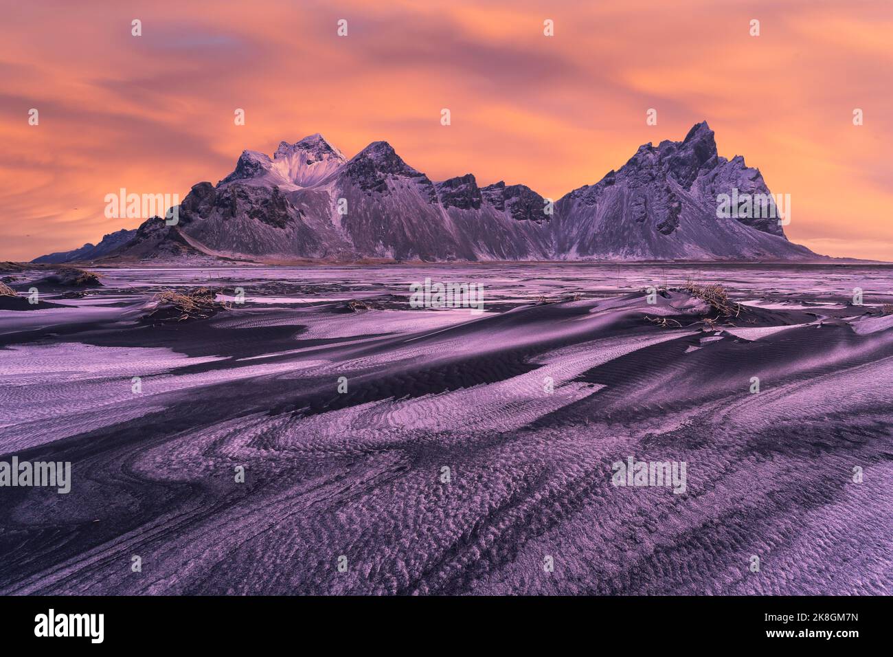 Spectacular Nordic scenery of calm frozen lake near rocky Vestrahorn ...