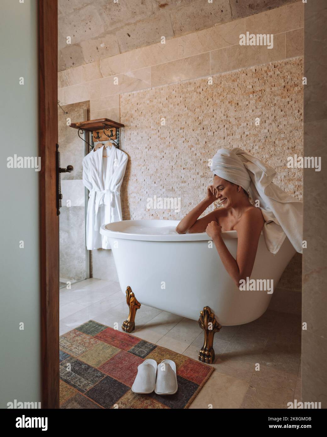 Woman taking bubble bath hi-res stock photography and images - Alamy