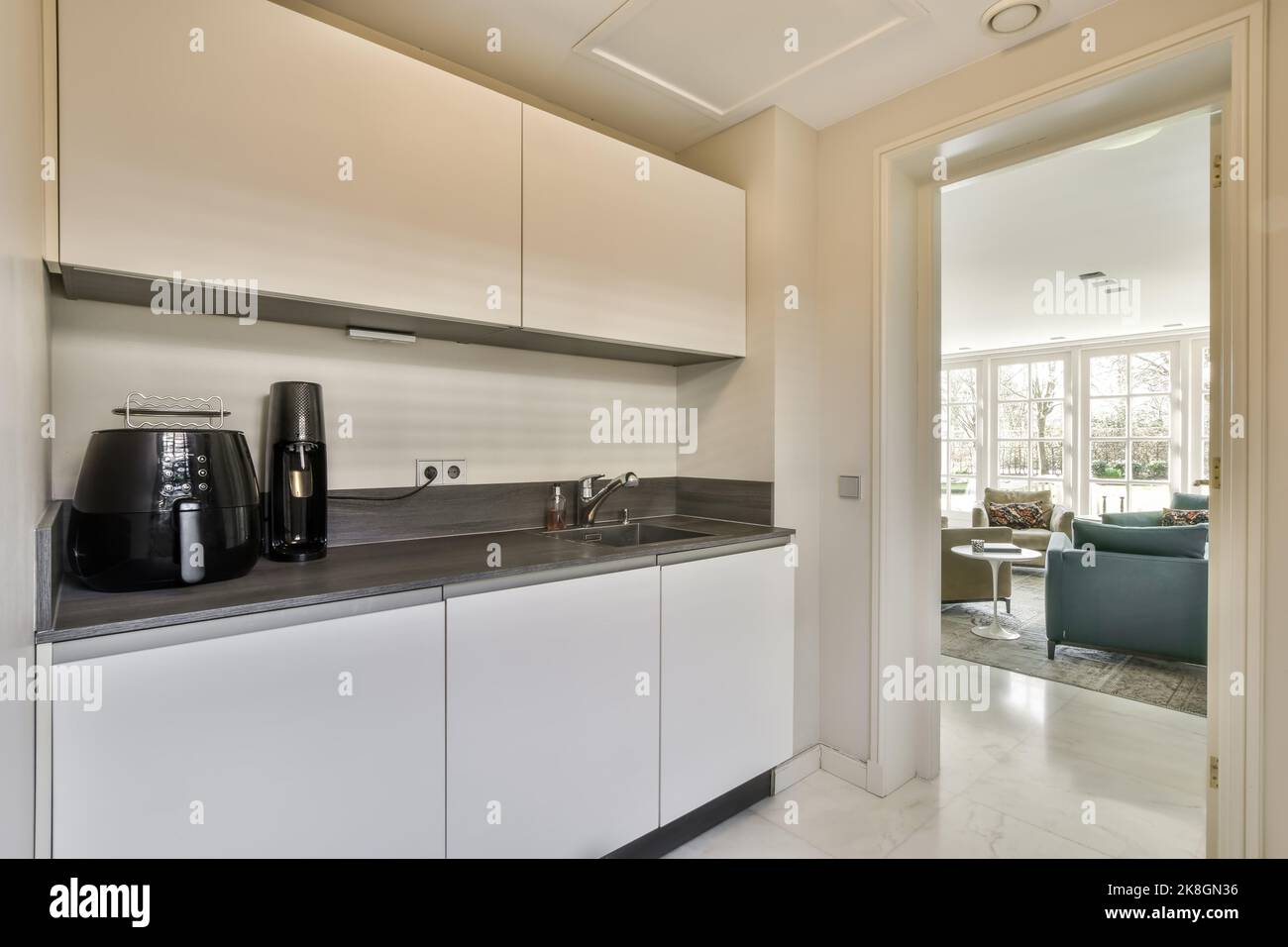 Comfortable sofa and coffee table in spacious studio apartment with ...