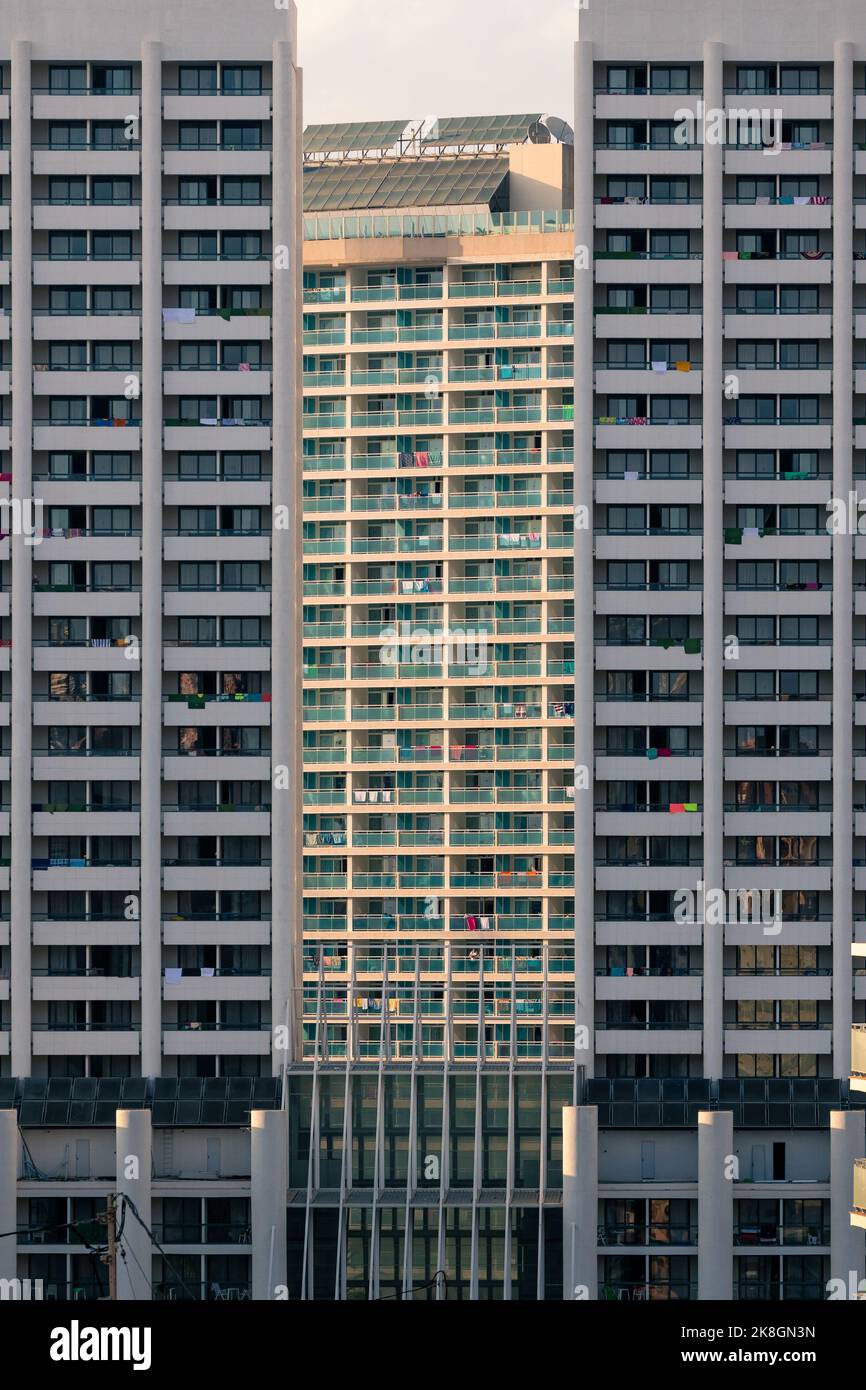 Tall high rise buildings with balconies and windows located on street ...