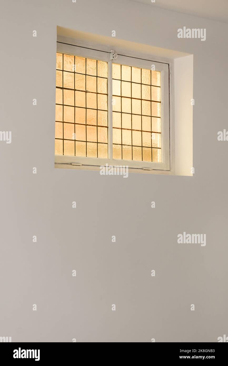 From below window on a white wall Stock Photo - Alamy