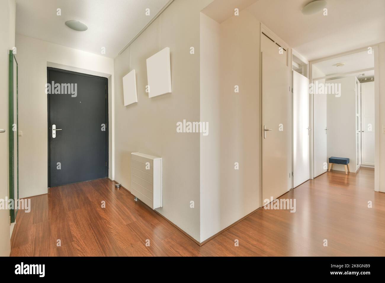 Interior passage way with parquet on wall in modern house Stock Photo ...