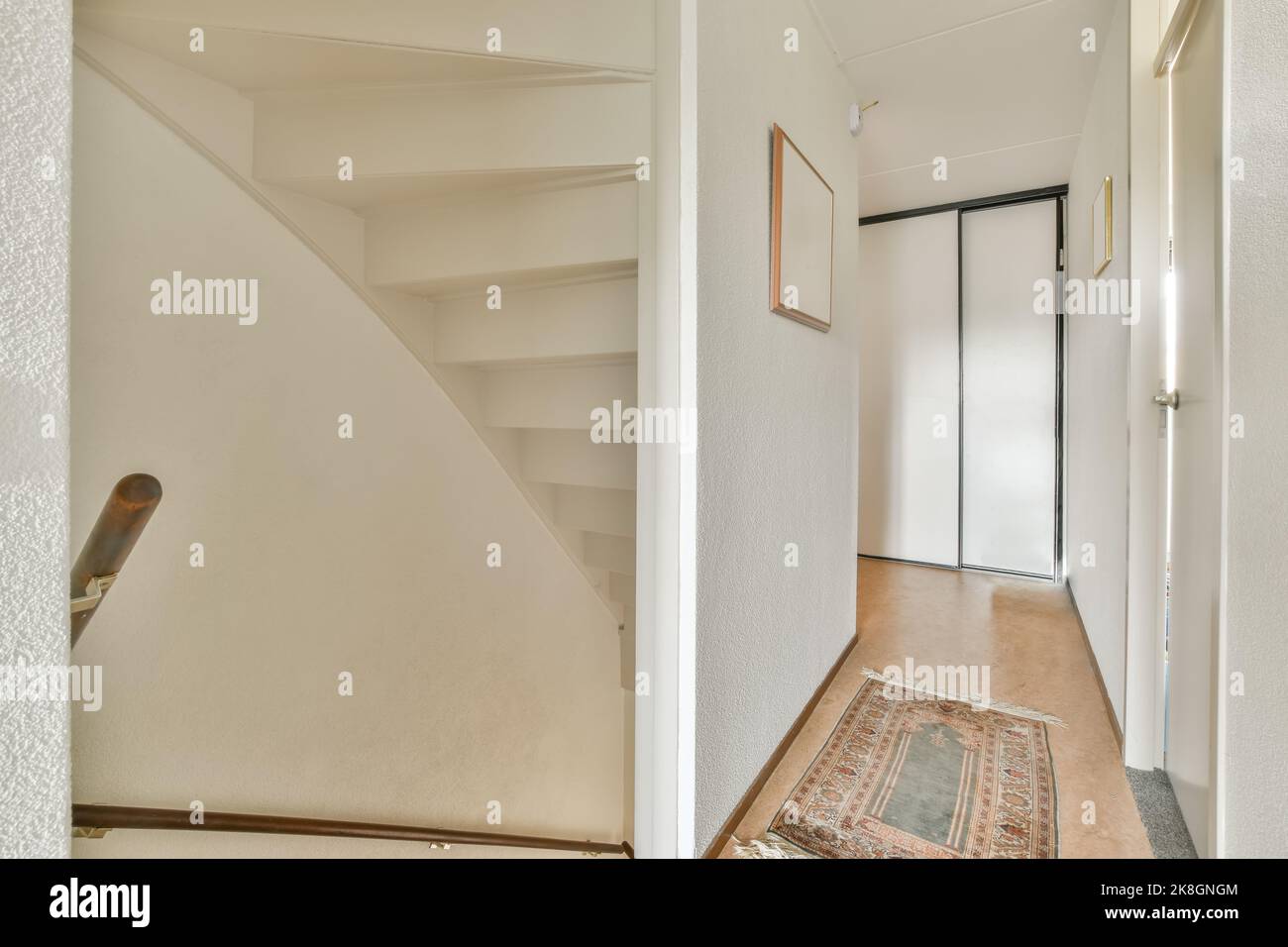 Interior of a house with stairs to an down floor in a bright ...