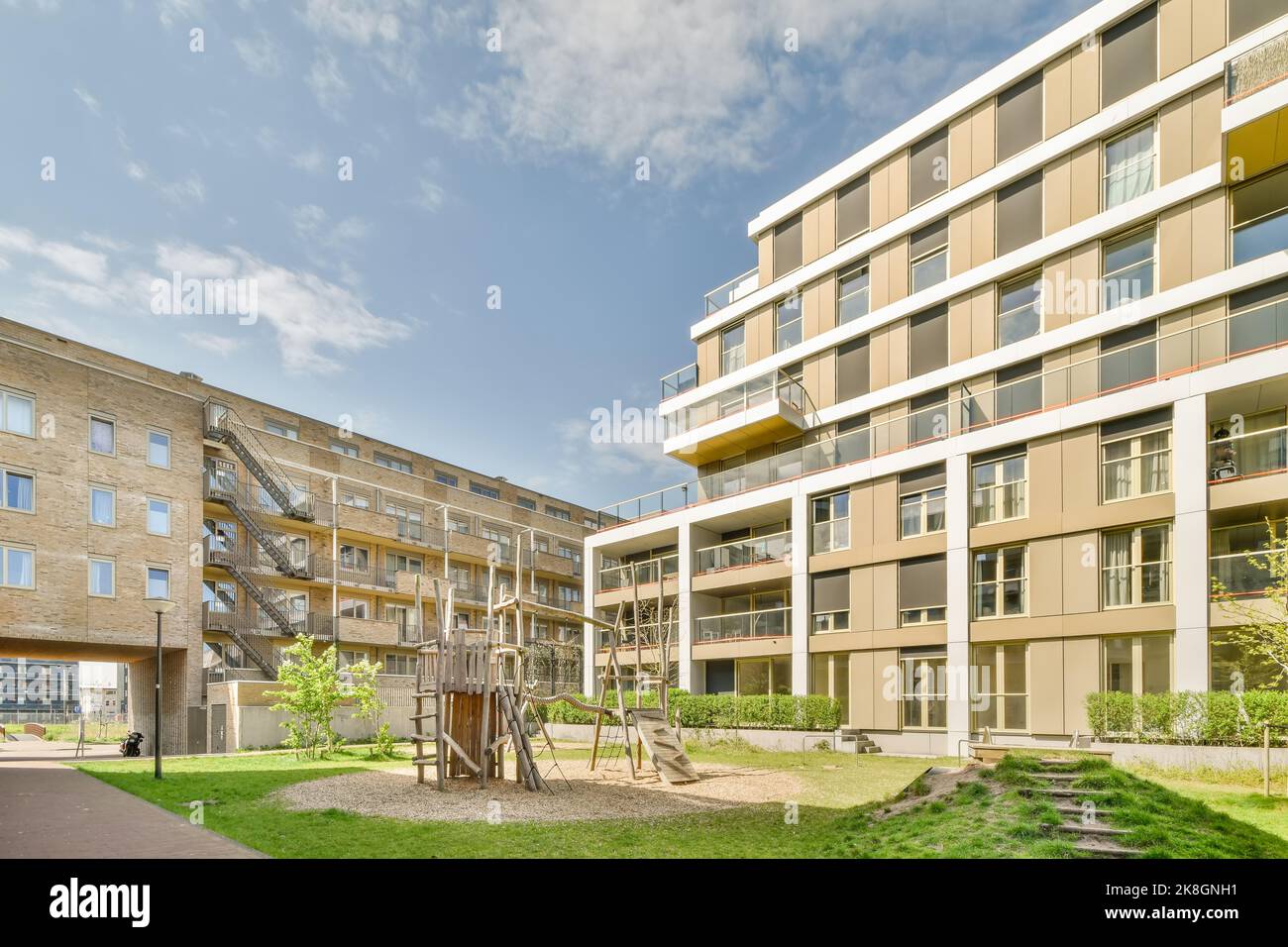 Children's playground of a community area of buildings under a blue sky ...
