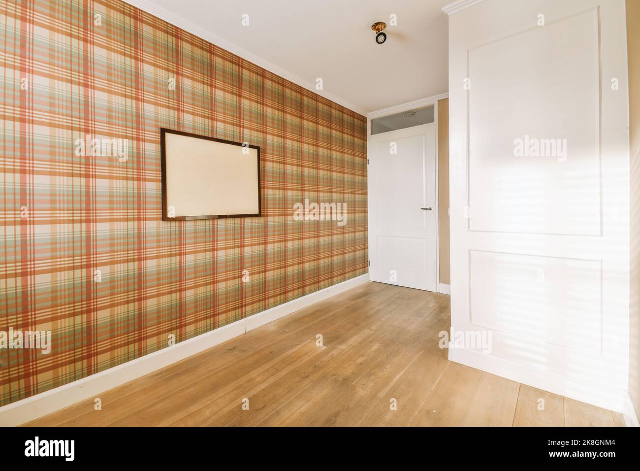 Interior of spacious empty light room with wallpaper and laminated ...