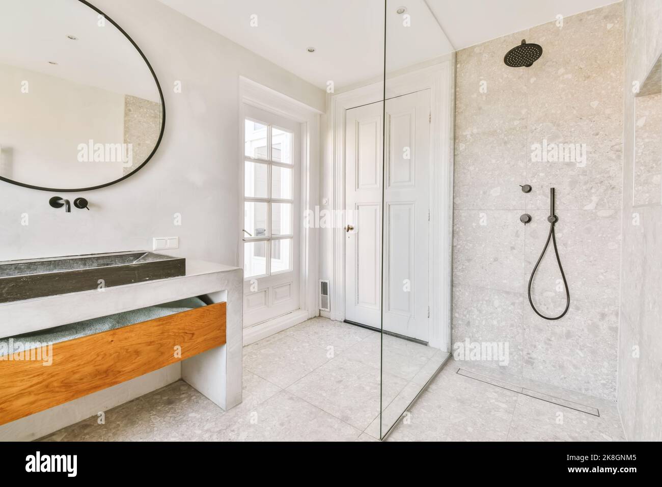 Interior of a sink with shower and white walls Stock Photo - Alamy