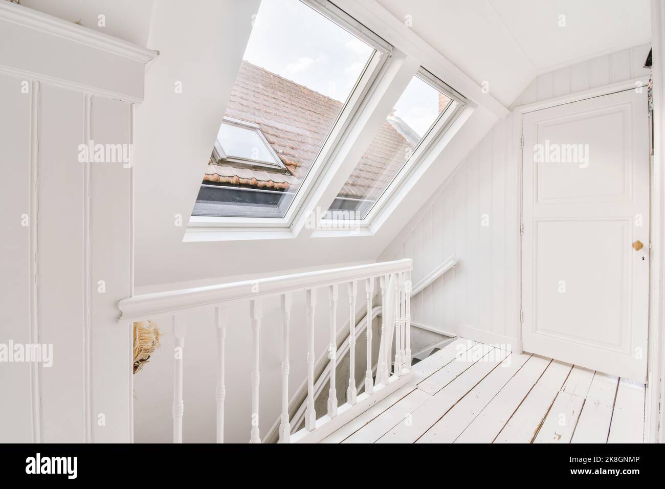 Interior of a house with stairs to an down floor in a bright ...