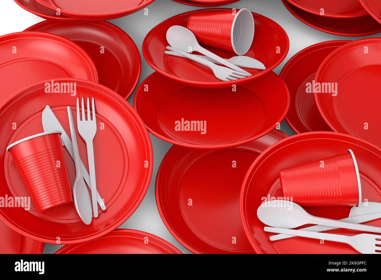 Heap of disposable utensils like plate, folk, spoon,knife and cup on ...