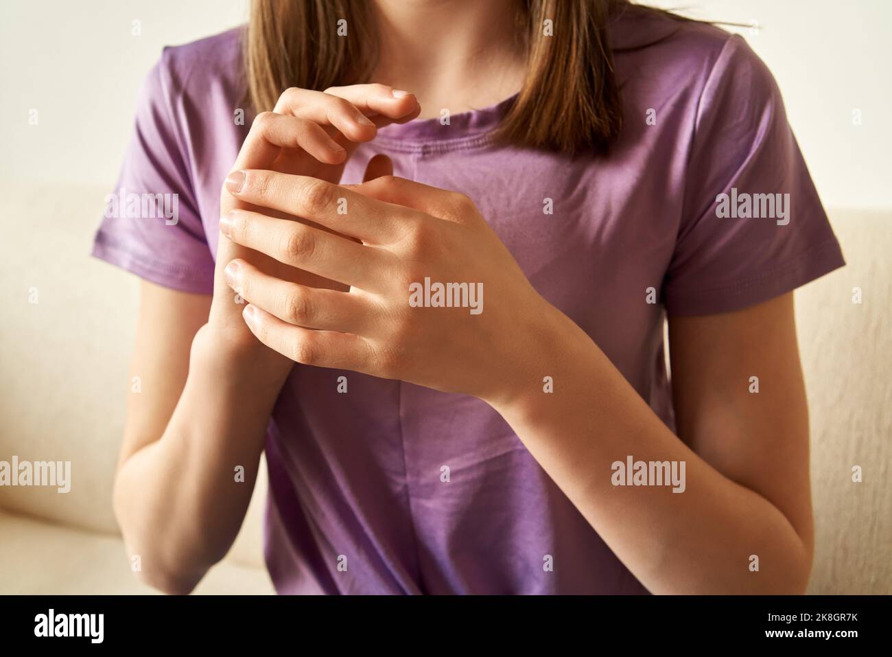 Girl doing EFT or emotional freedom technique - tapping on the karate ...