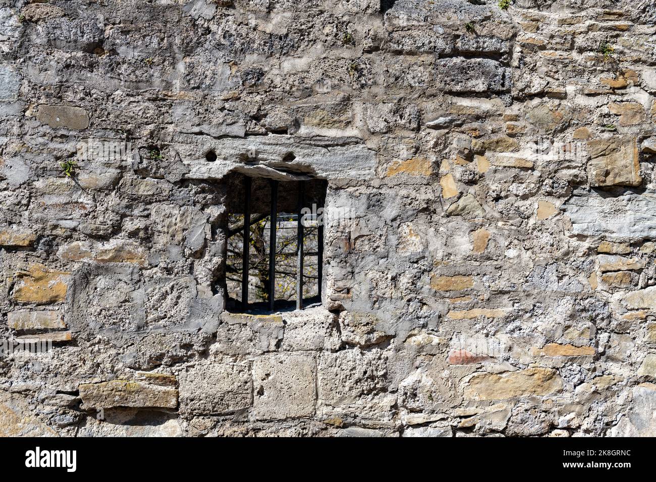 Stone wall of a medieval fortress with window Stock Photo - Alamy