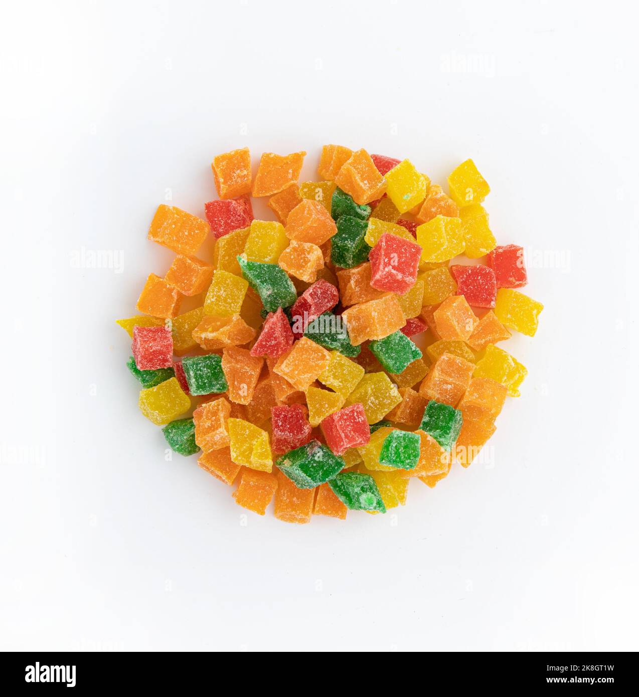 heap of candied fruit pieces close up isolated on white background ...