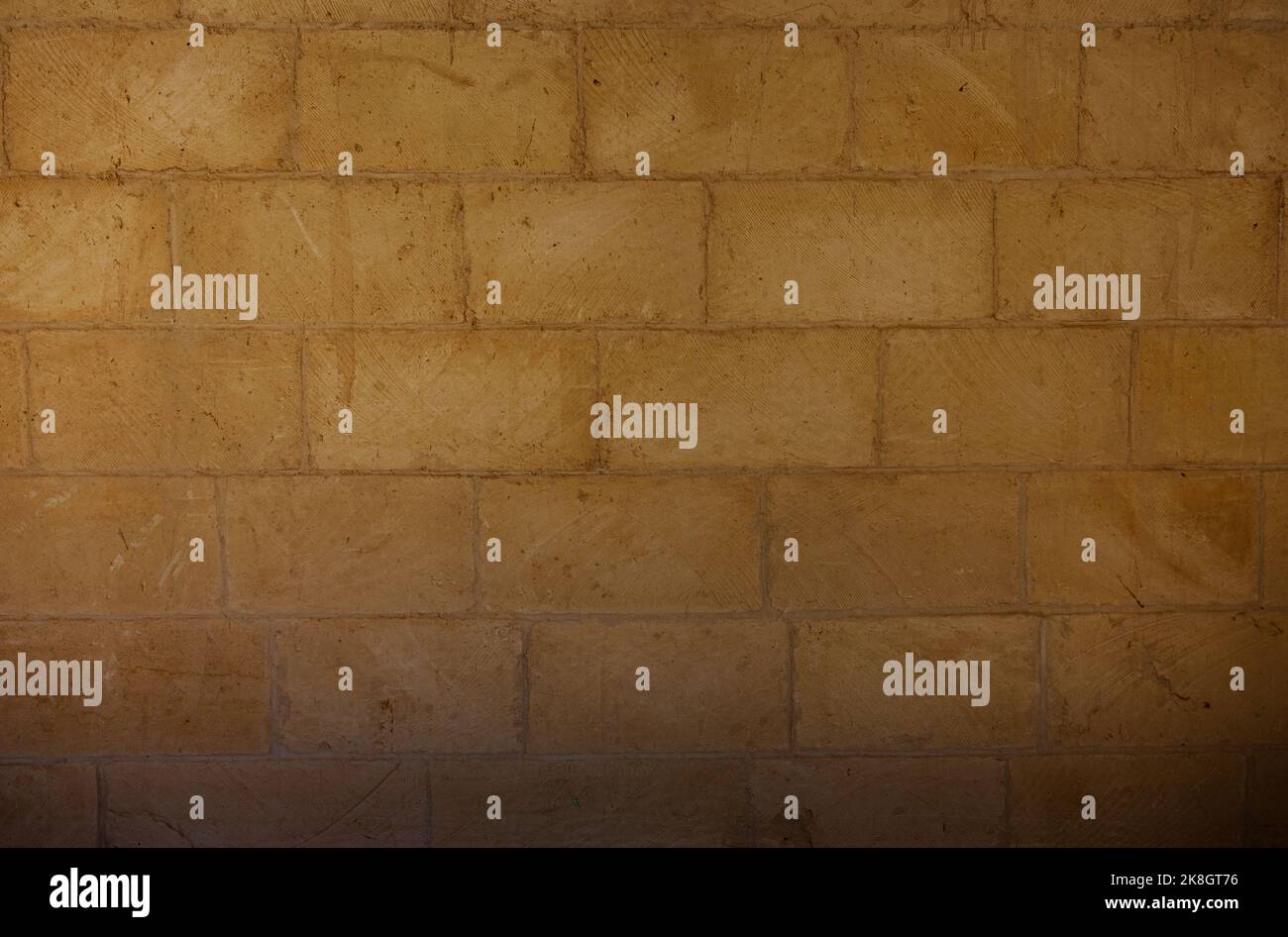 Old yellow stone wall background Stock Photo - Alamy