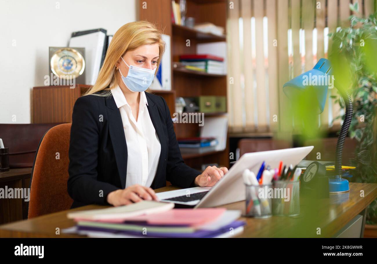 Attractive blonde secretary sitting desk hi-res stock photography and ...