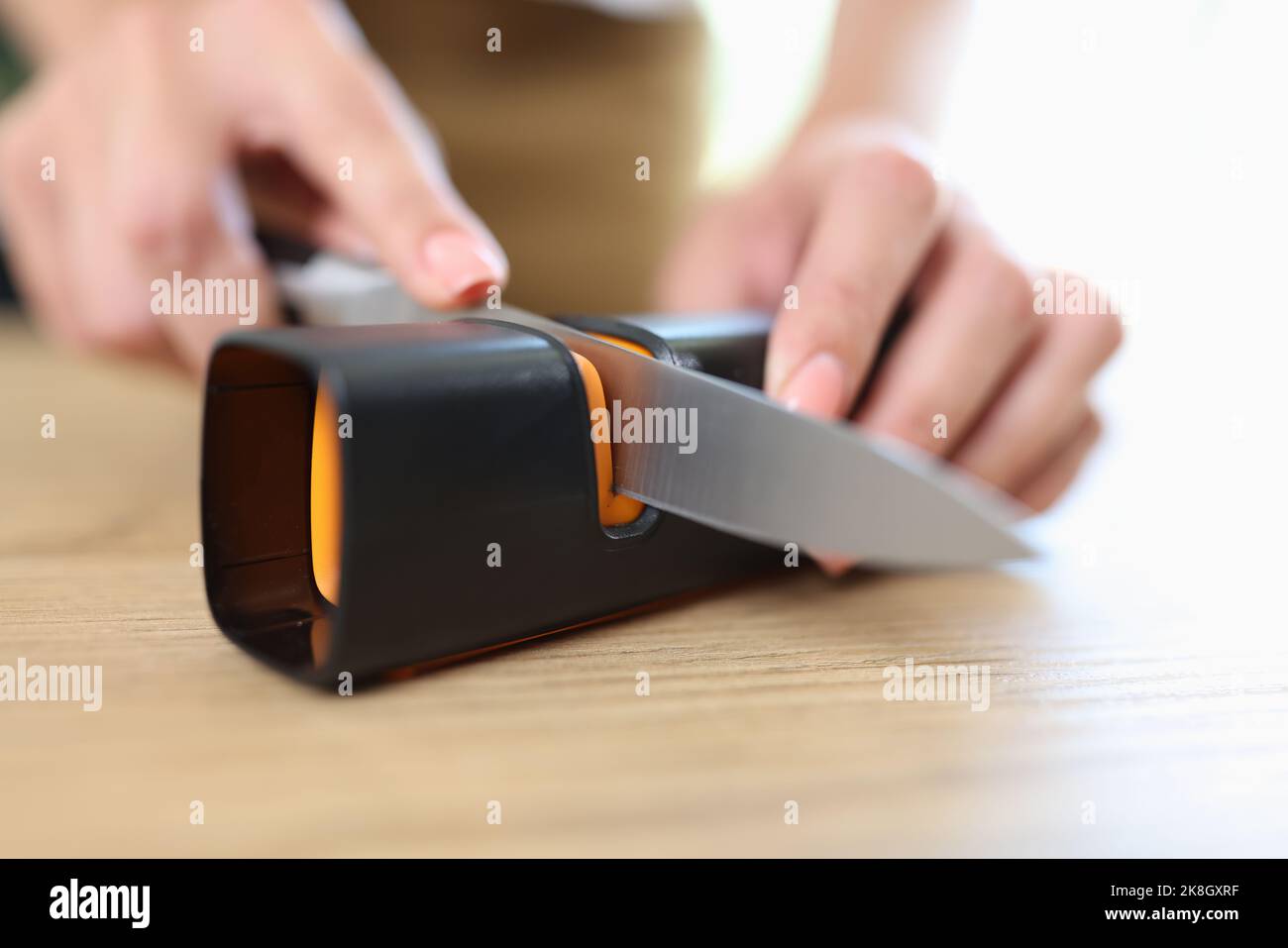 Cook sharpening knives hi-res stock photography and images - Alamy