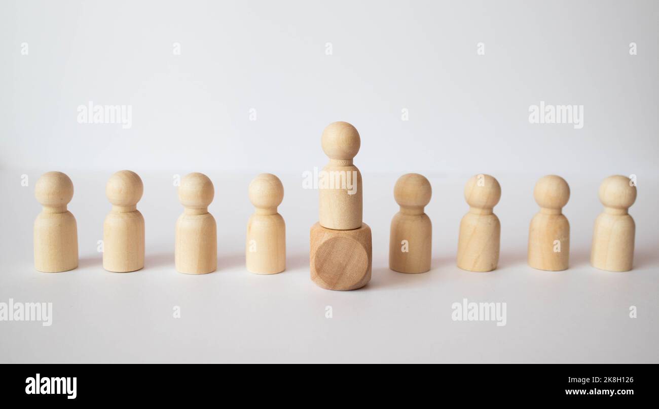 The chosen person among others. A human figure of green color stands ...