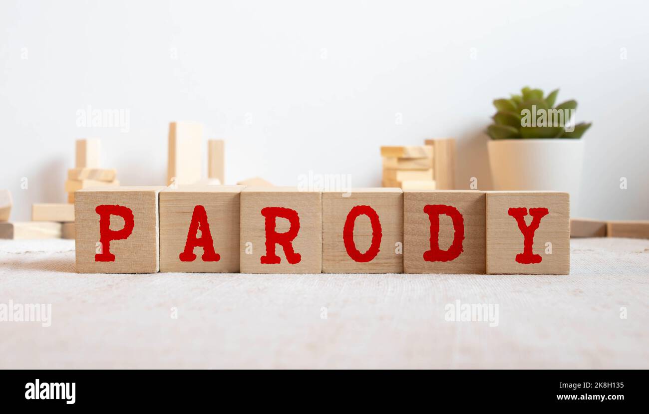 Parody, word cube with background Stock Photo - Alamy